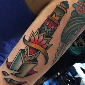 Traditional dagger tattoo on the sternum - Tattoogrid.net