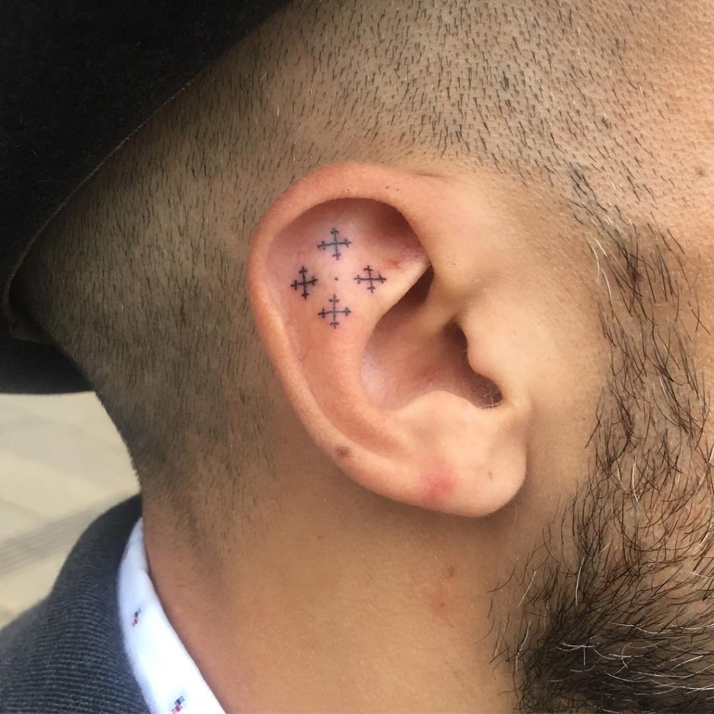 Ornamental ear tattoo by Remy B - Tattoogrid.net