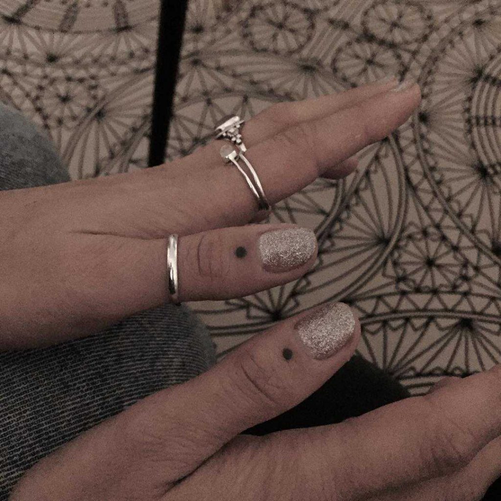 Dagger tattoo on the finger - Tattoogrid.net