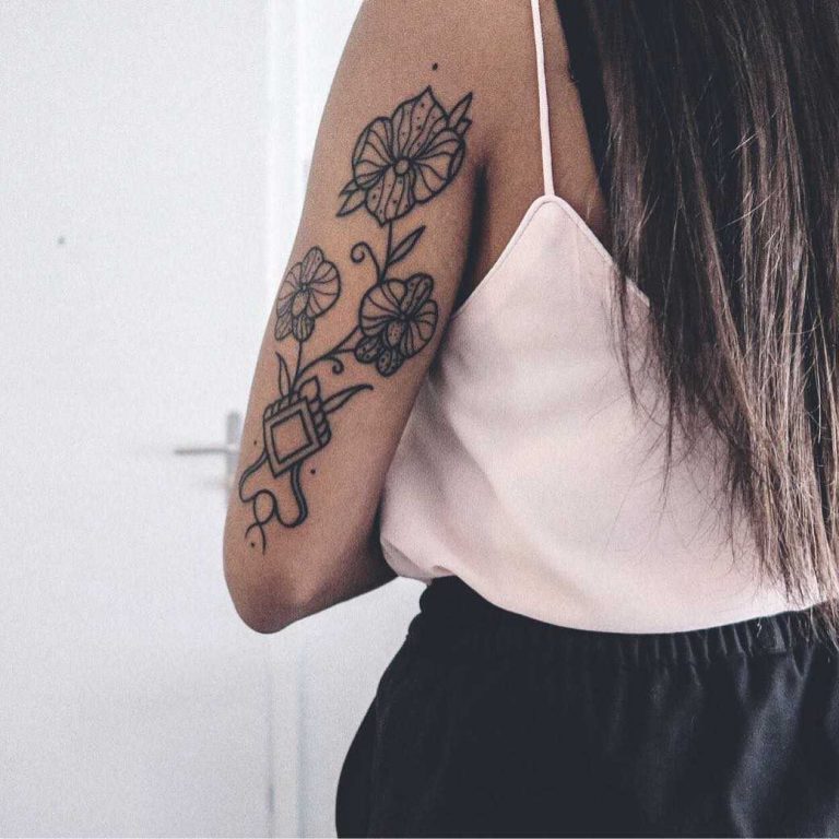 Black rose tattoo on the left forearm - Tattoogrid.net