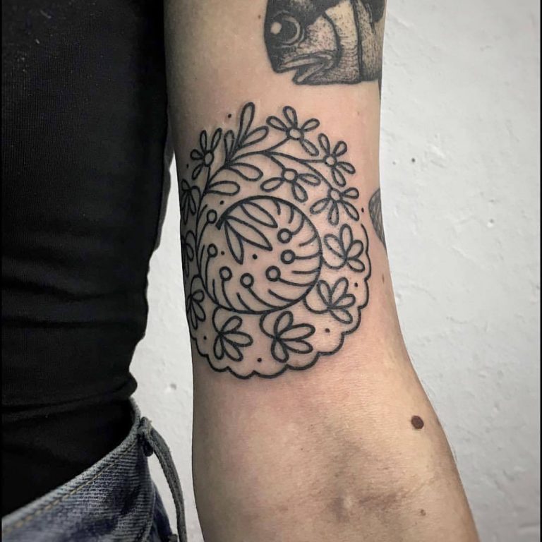 Negative space flower tattoo on the forearm - Tattoogrid.net