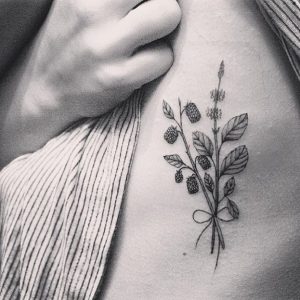 Small wave tattoo on the rib cage - Tattoogrid.net