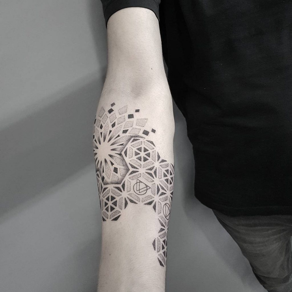 Black geometric pattern tattoo on the leg - Tattoogrid.net