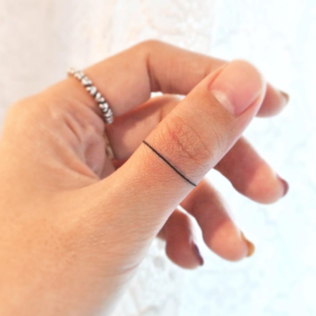 Runes on fingers - Tattoogrid.net