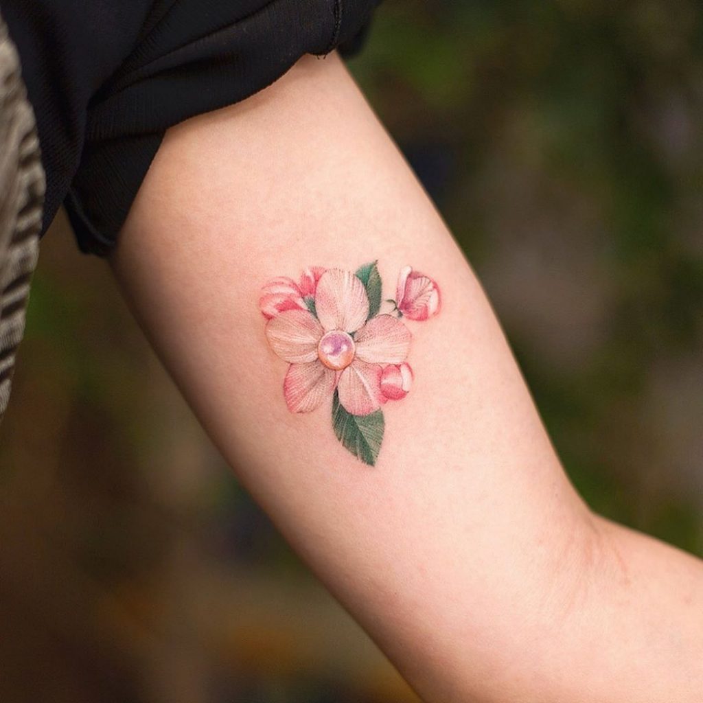 Pink flower tattoo by Mavka Leesova - Tattoogrid.net