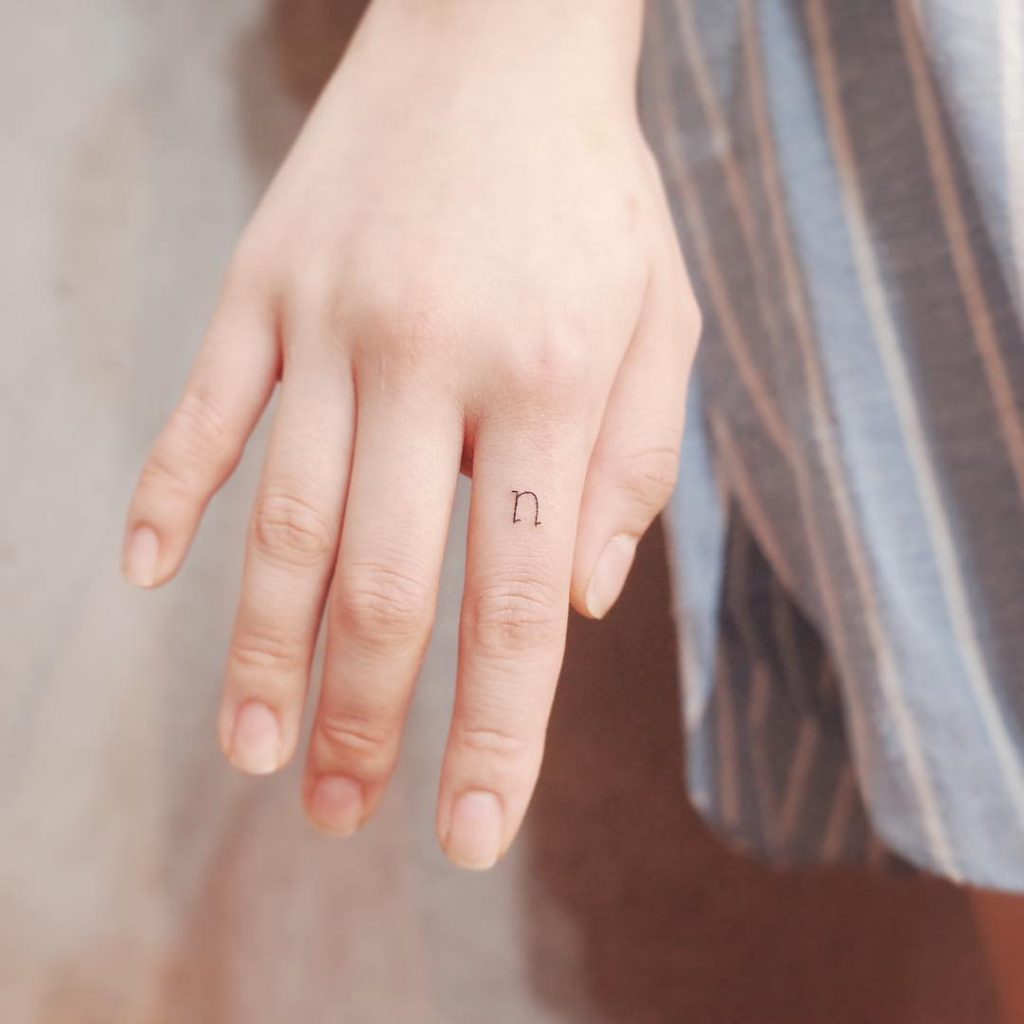 Symbol tattoos on the fingers - Tattoogrid.net