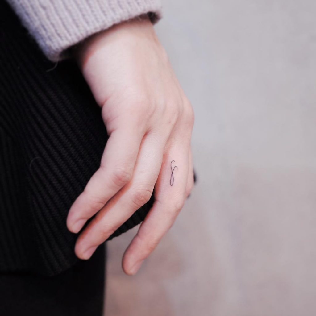 Dagger tattoo on the finger - Tattoogrid.net