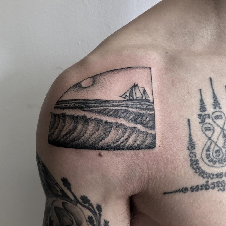 Black snake tattoo on the shoulder - Tattoogrid.net